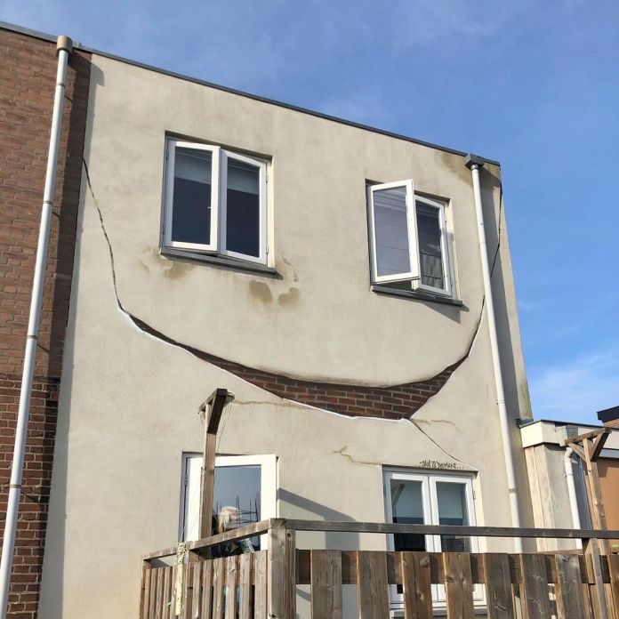 Building With Smiley Face | STREET ART UTOPIA