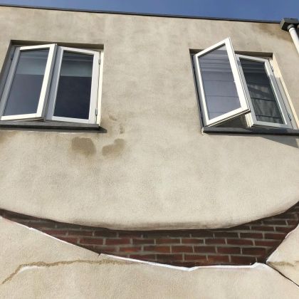 Building With Smiley Face | STREET ART UTOPIA