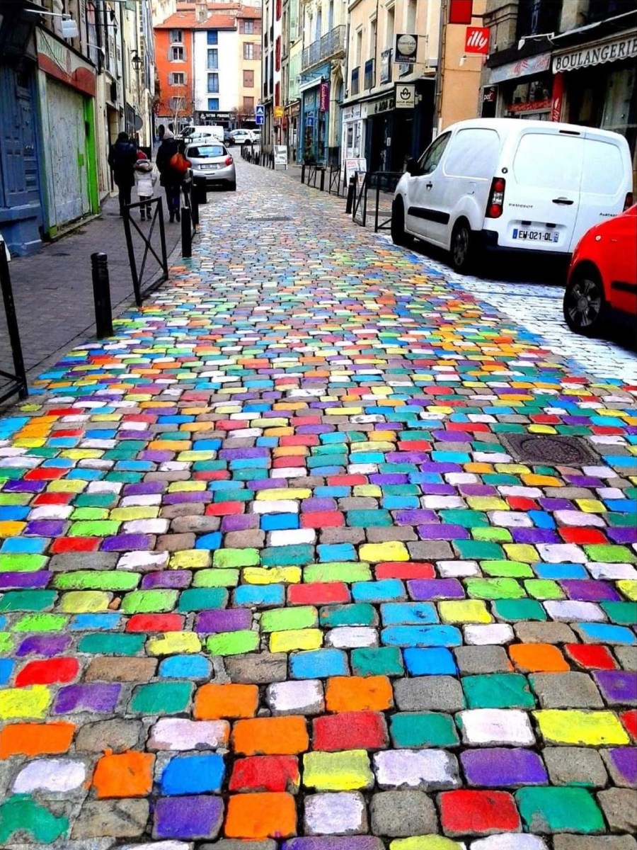 Painted cobble stones bringing colours to French village of Le Puy en ...