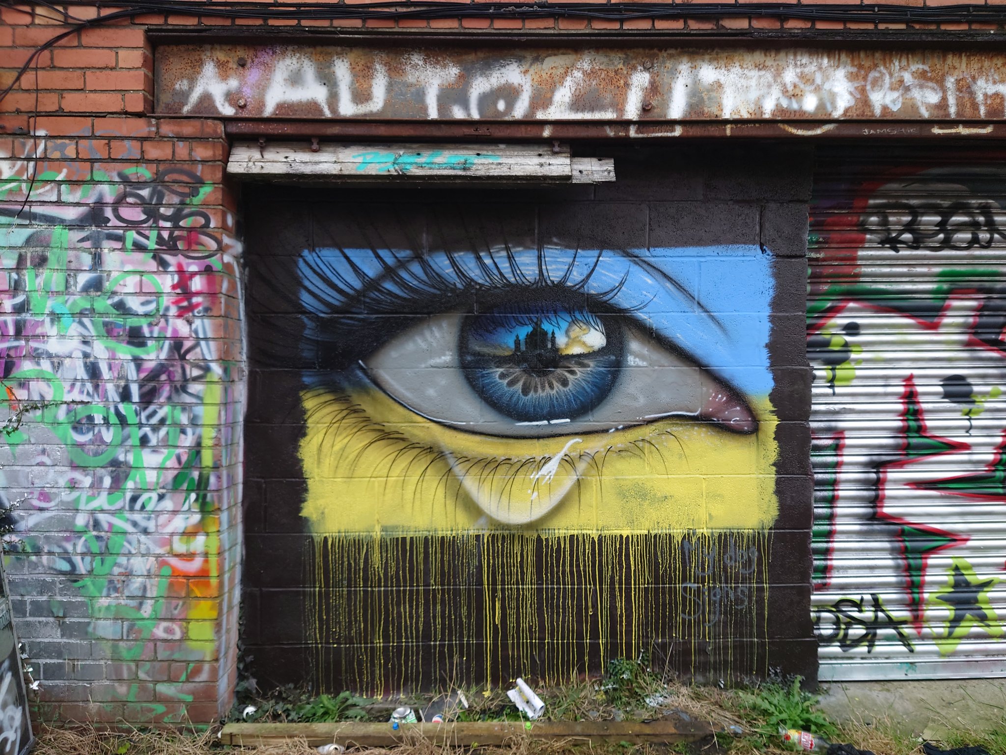 Beautiful artwork of a crying eye featuring Ukraine’s flag and bombing ...