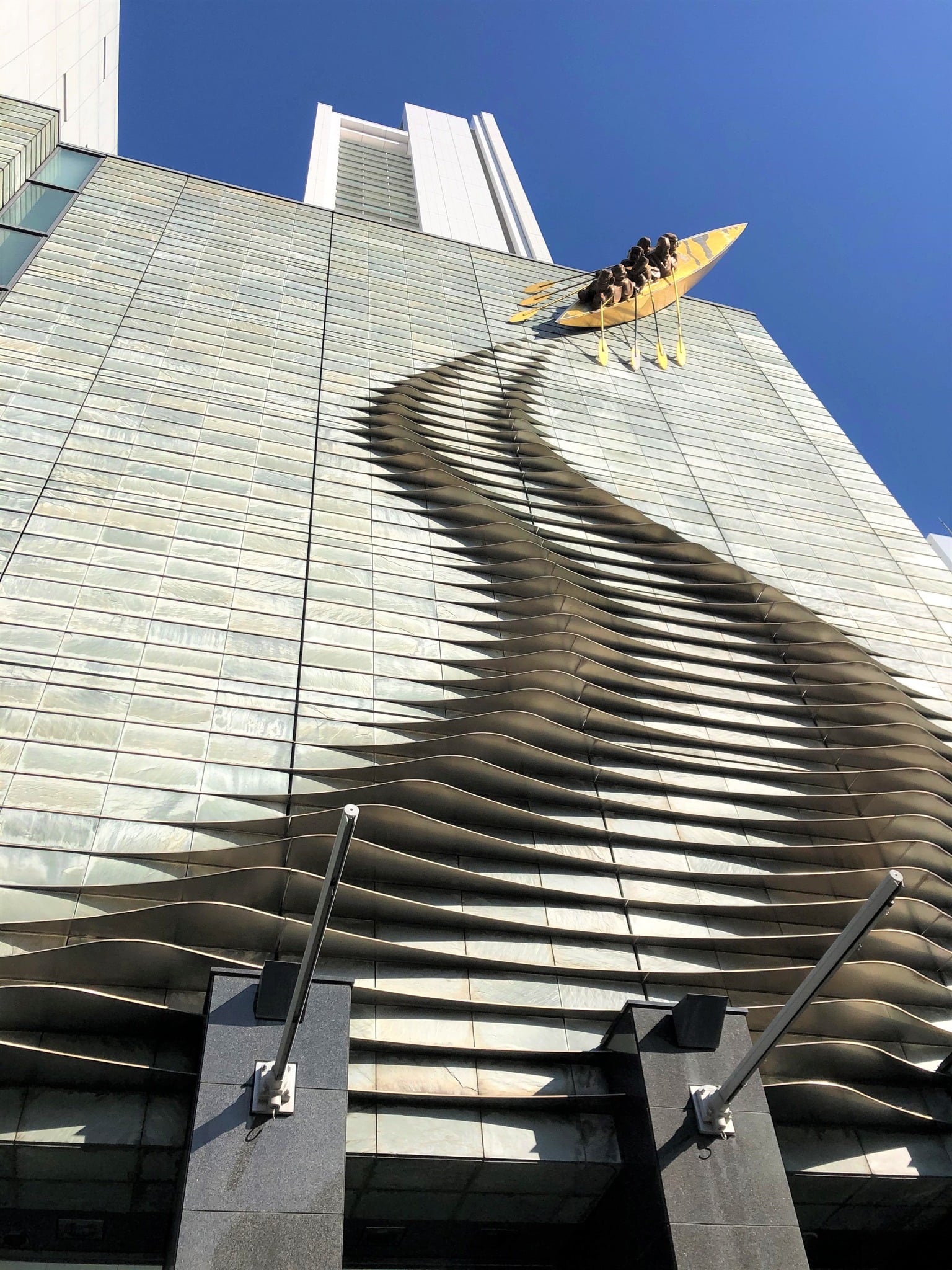 Sculpture of a canoe climbing a high-rise building in Osaka, Japan ...