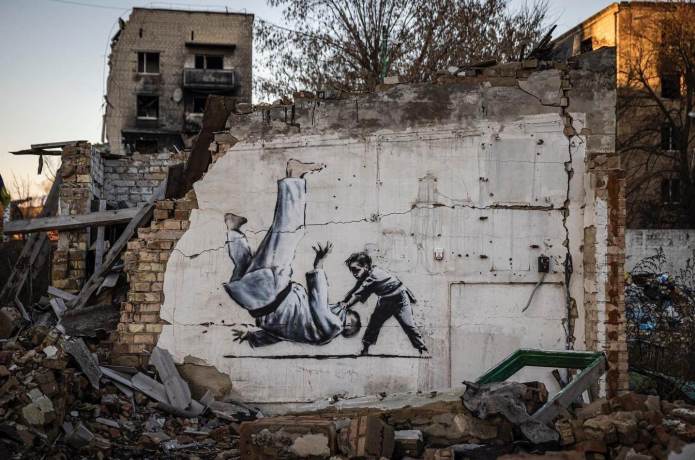 Street Art by Banksy in Ukraine depicts a boy throwing Putin to the ...