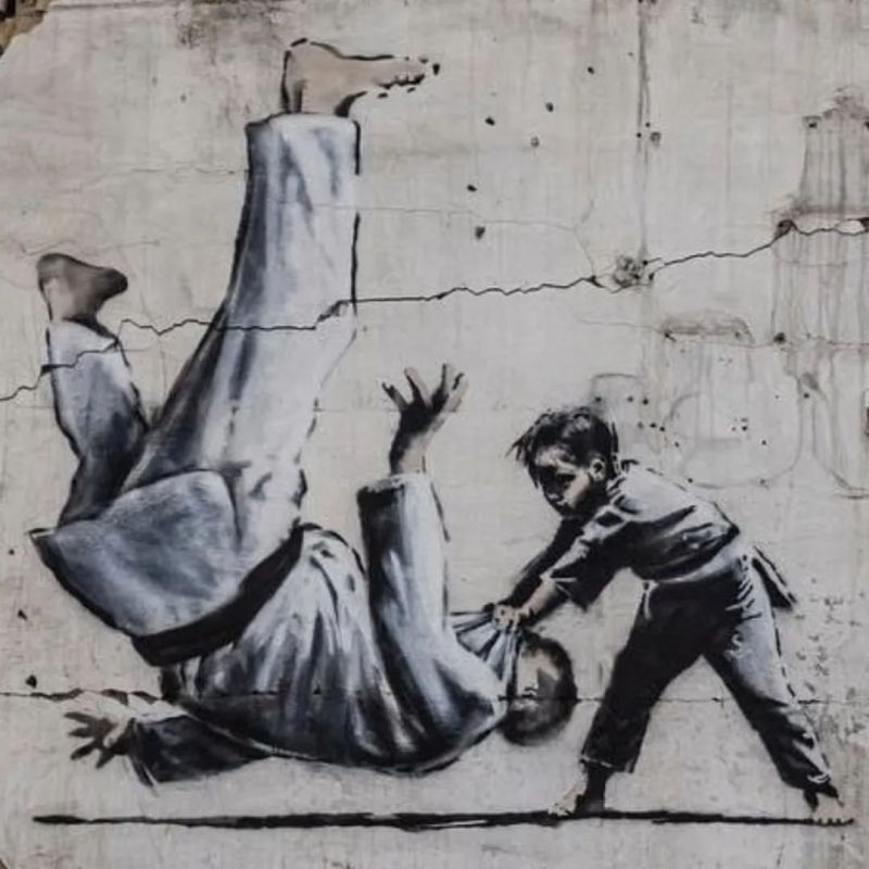 Street Art by Banksy in Ukraine depicts a boy throwing Putin to the ...
